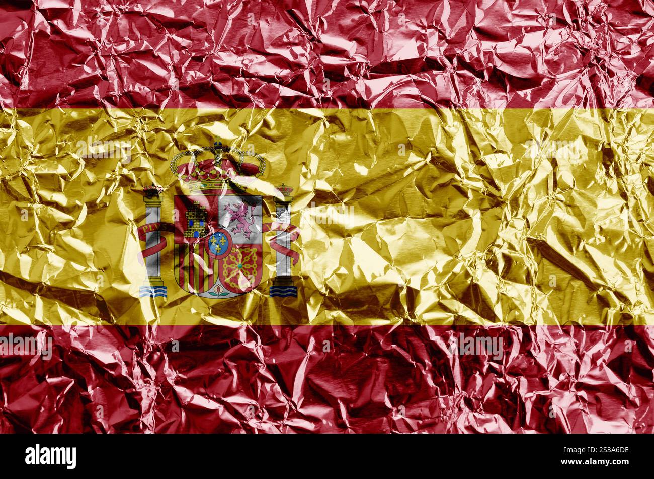 Spain flag depicted in paint colors on shiny crumpled aluminium foil ...