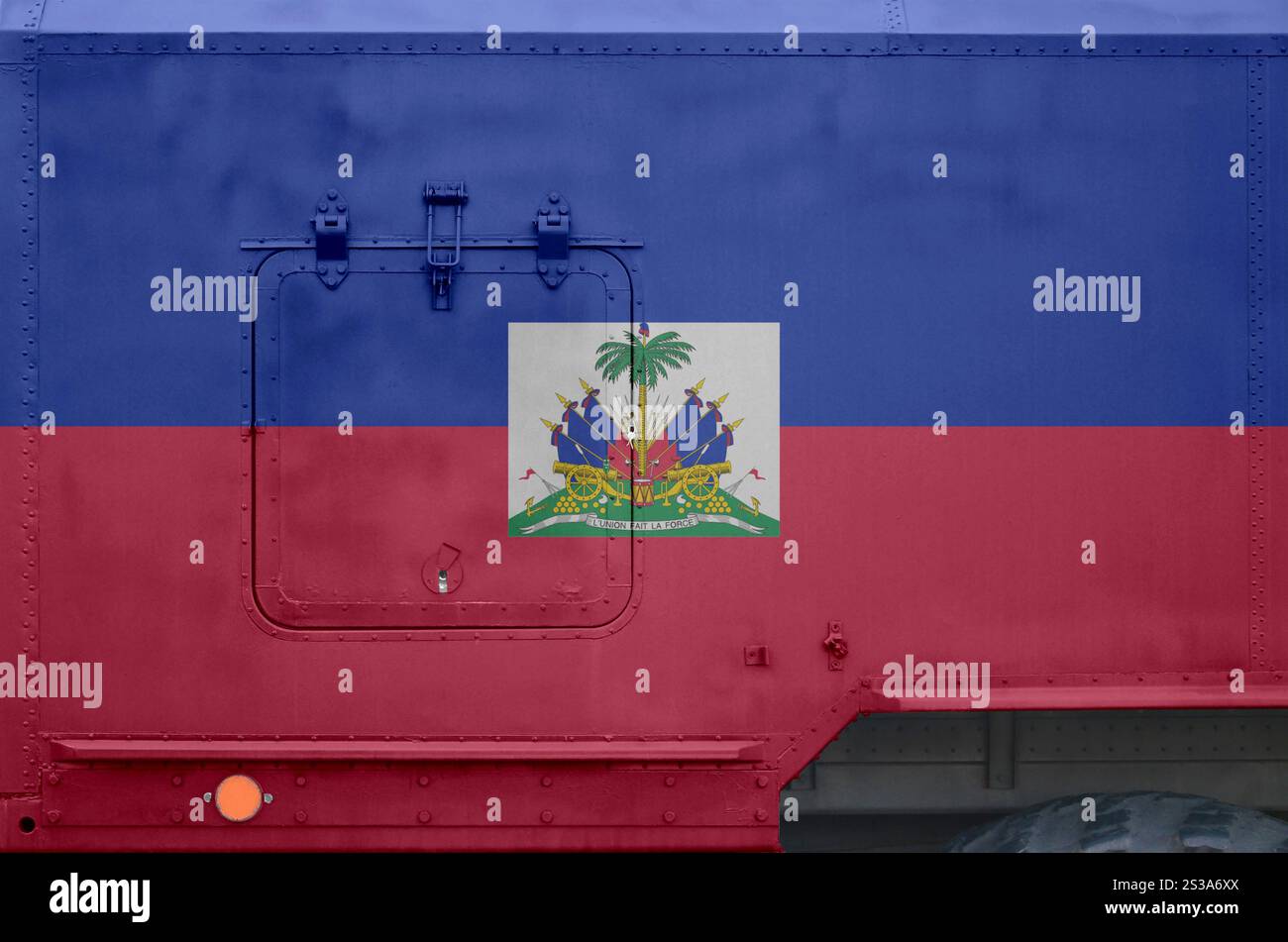 Haiti flag depicted on side part of military armored truck close up ...