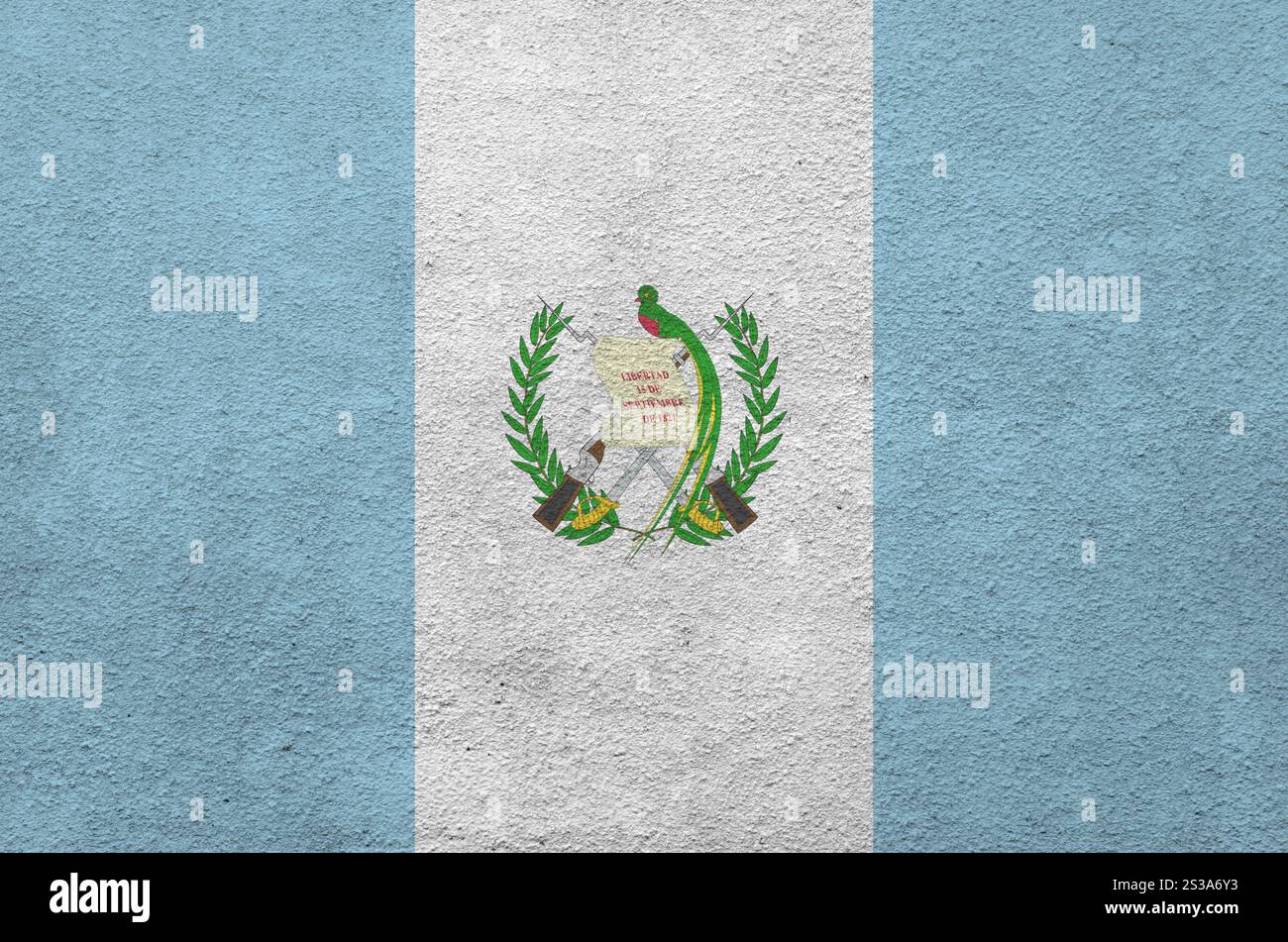 Guatemala flag depicted in bright paint colors on old relief plastering ...