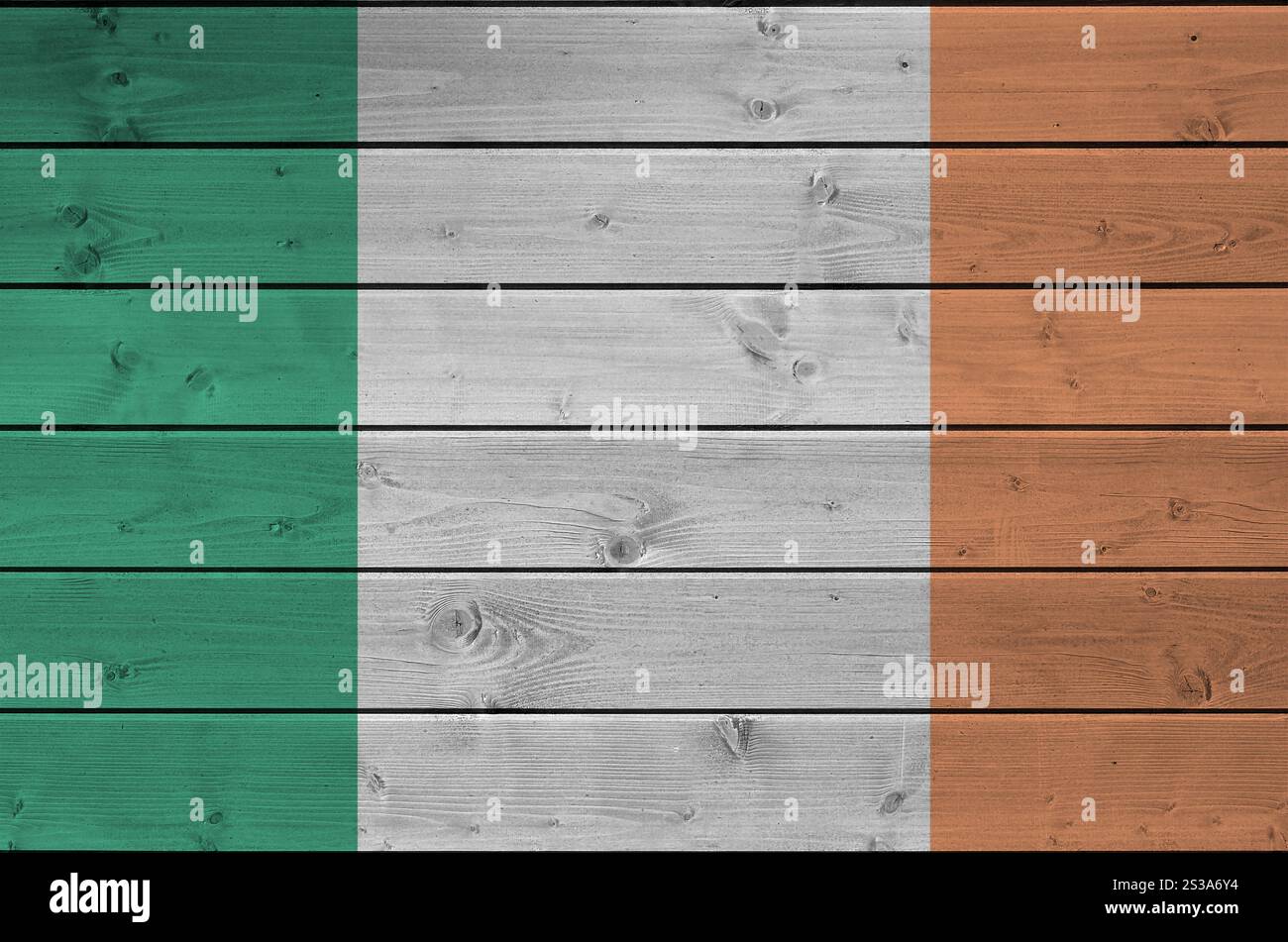 Ireland flag depicted in bright paint colors on old wooden wall close ...