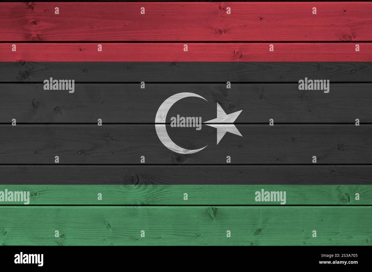 Libya flag depicted in bright paint colors on old wooden wall close up ...
