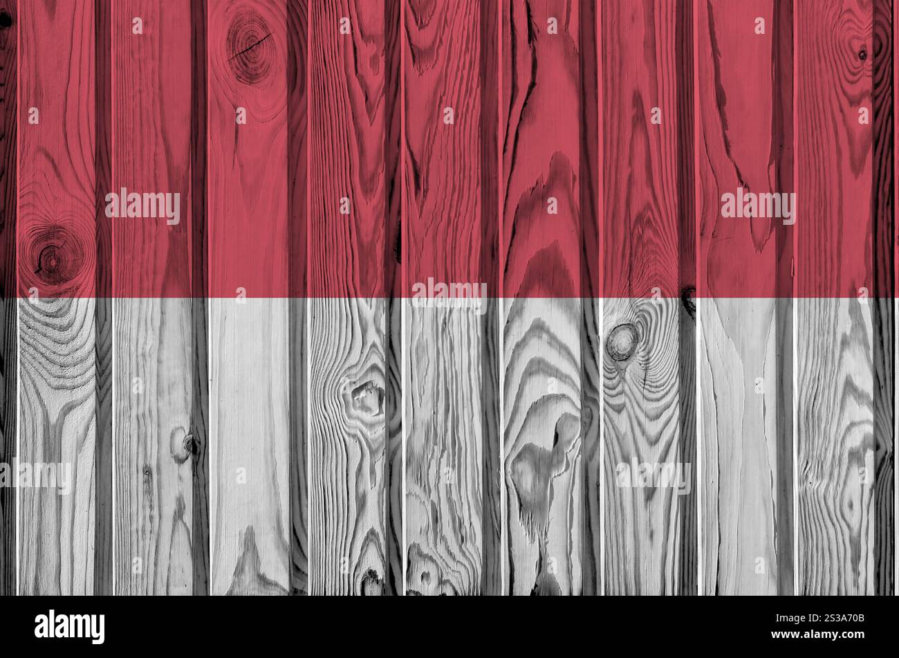 Monaco flag depicted in bright paint colors on old wooden wall close up ...