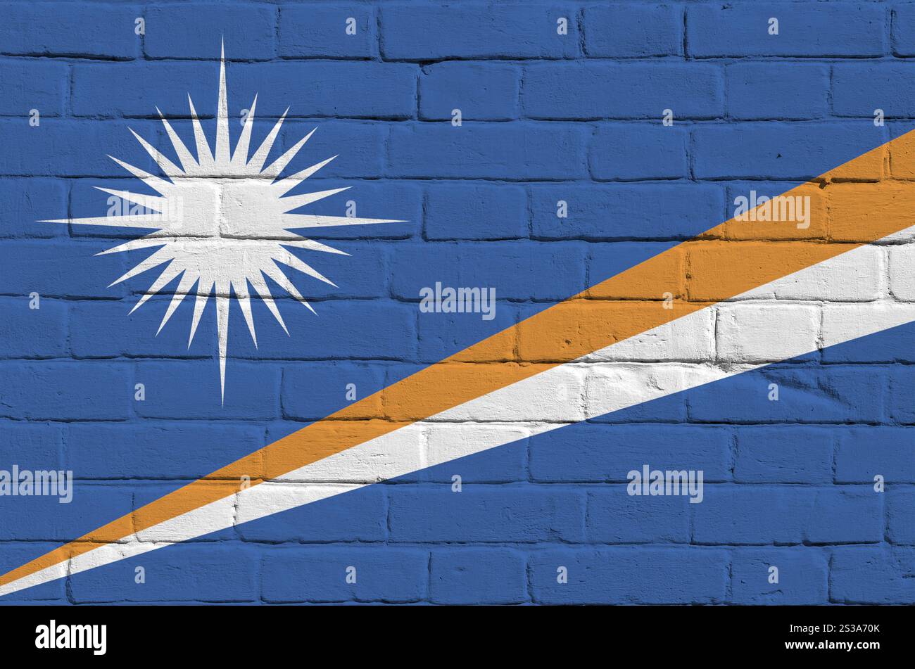 Marshall Islands flag depicted in paint colors on old brick wall close ...