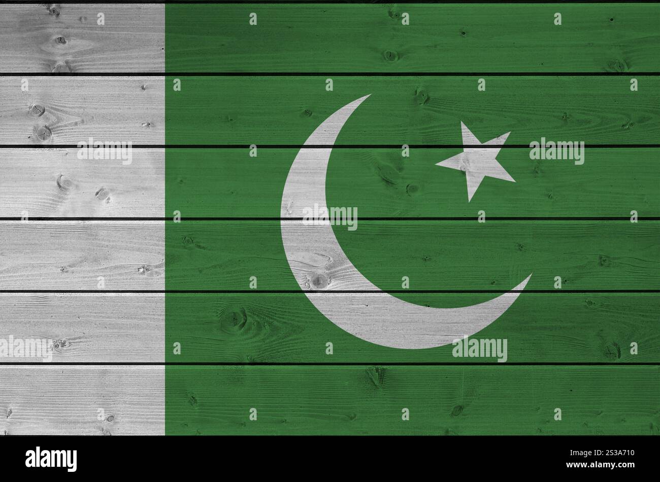 Pakistan flag depicted in bright paint colors on old wooden wall close ...