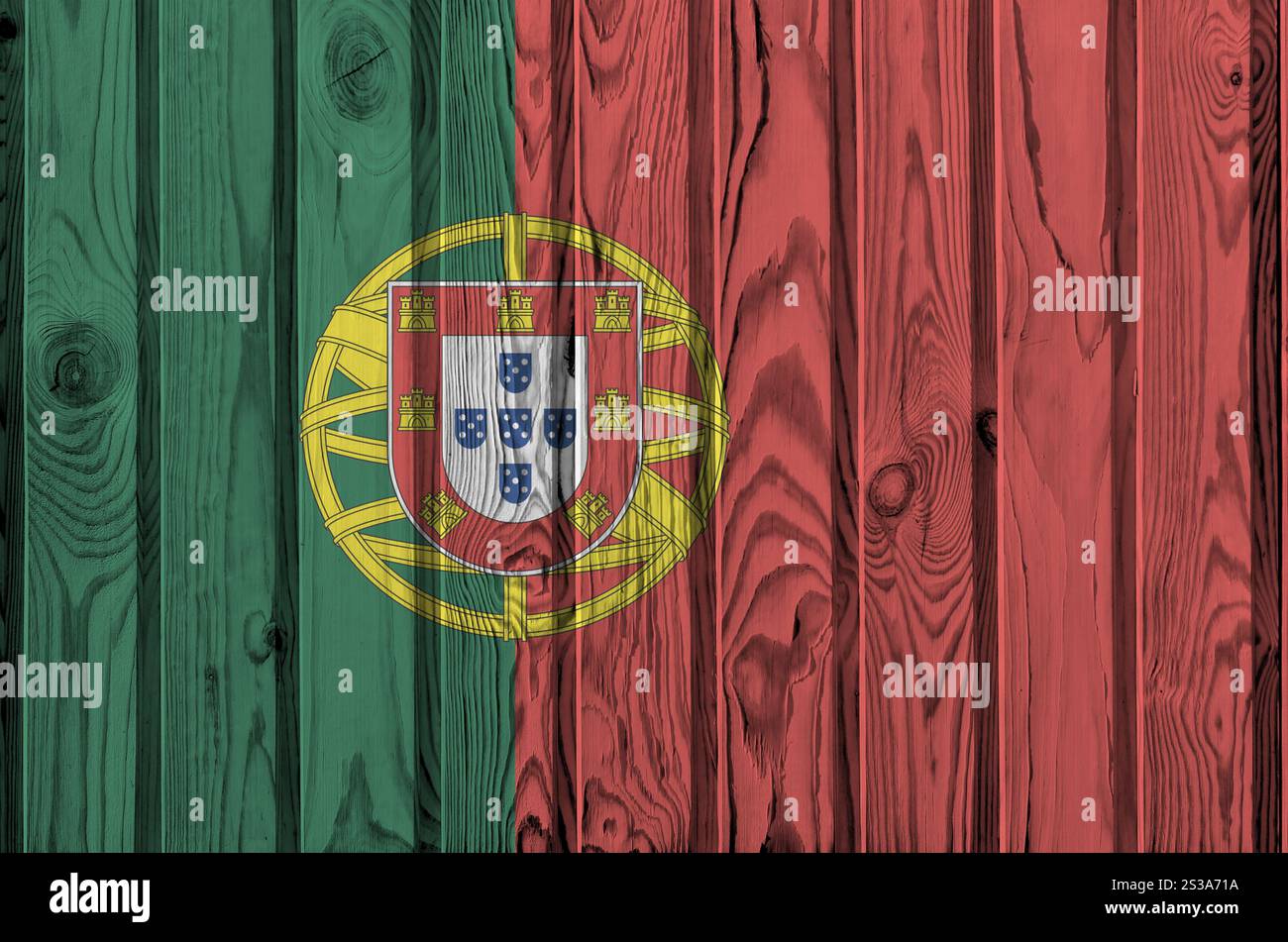 Portugal flag depicted in bright paint colors on old wooden wall close ...