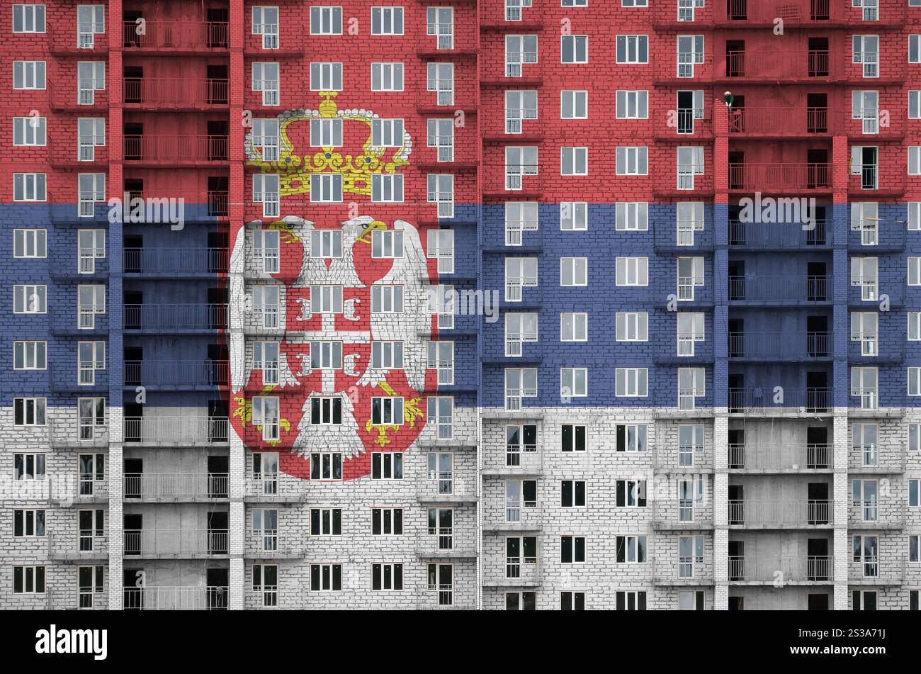 Serbia flag depicted in paint colors on multi-storey residental ...