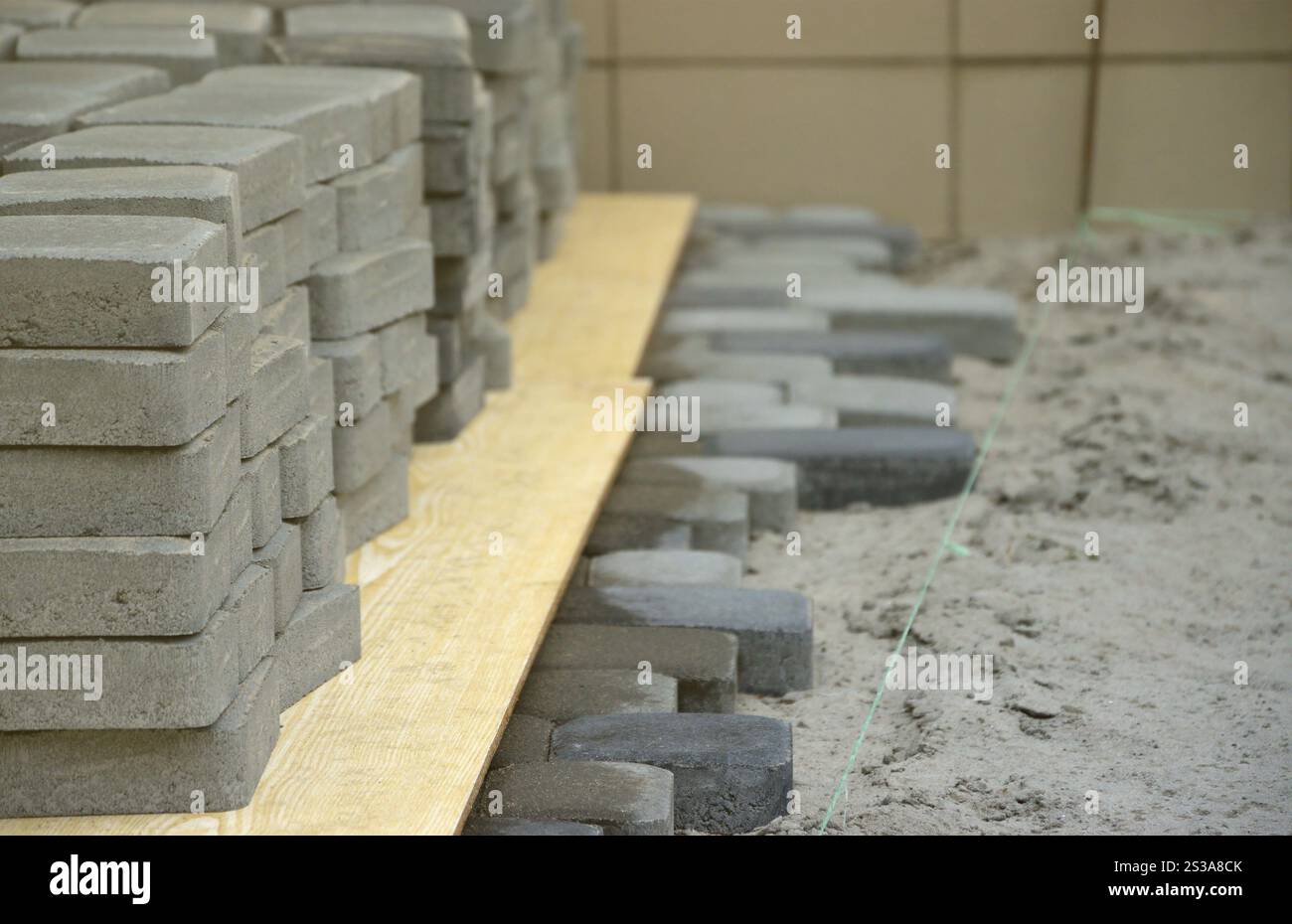 Rows of gray and dark grey walkway slab lying outdoors. Material for ...