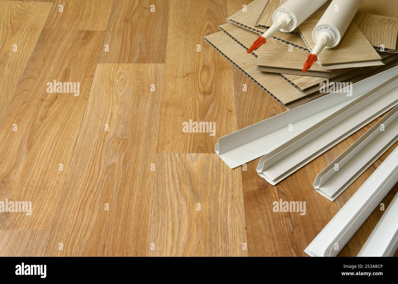 Set of items for PVC ceiling indoor works. Assembly adhesive bottles ...