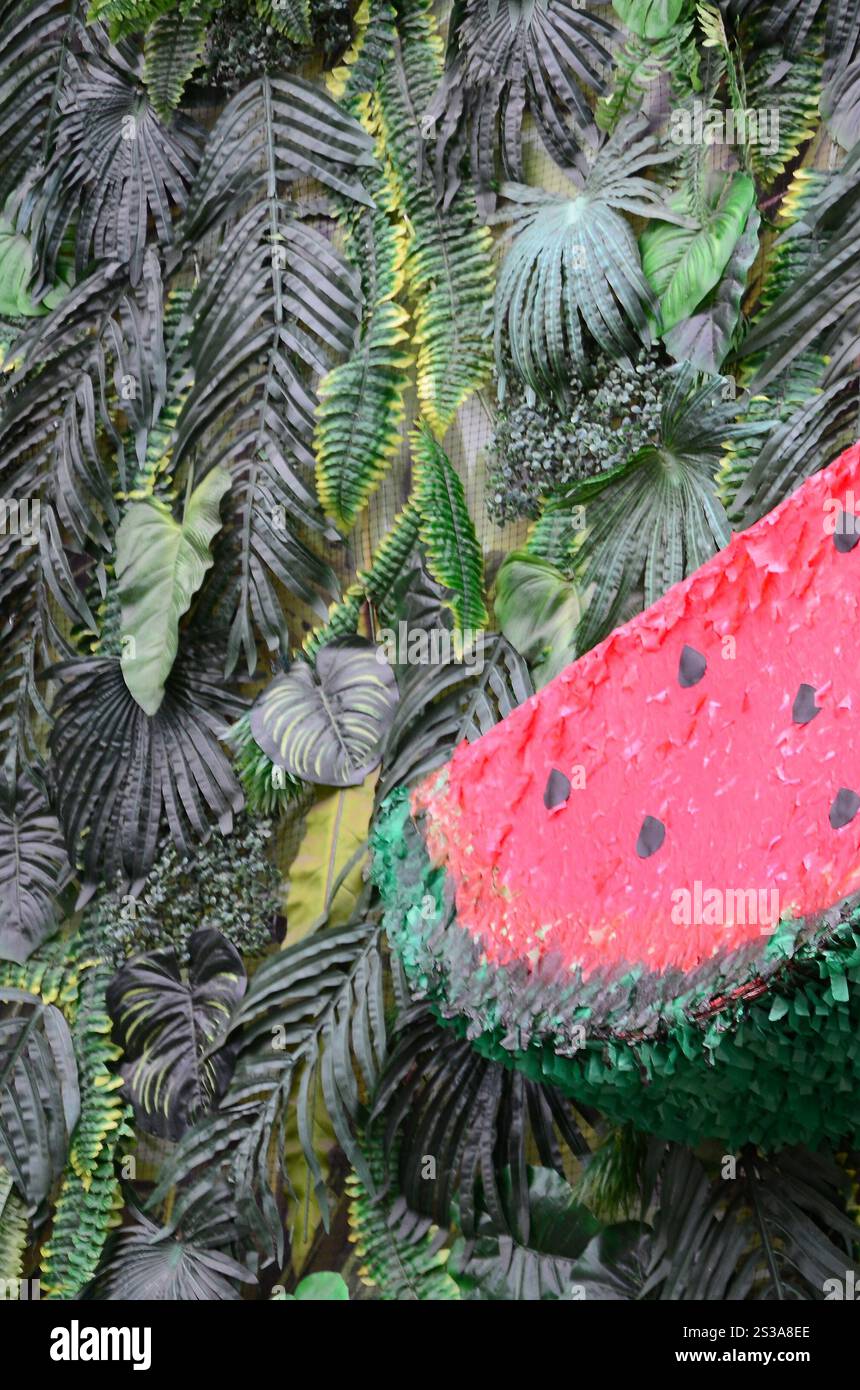 Tropical pattern with jungle leaves and watermelon fruit floral ...