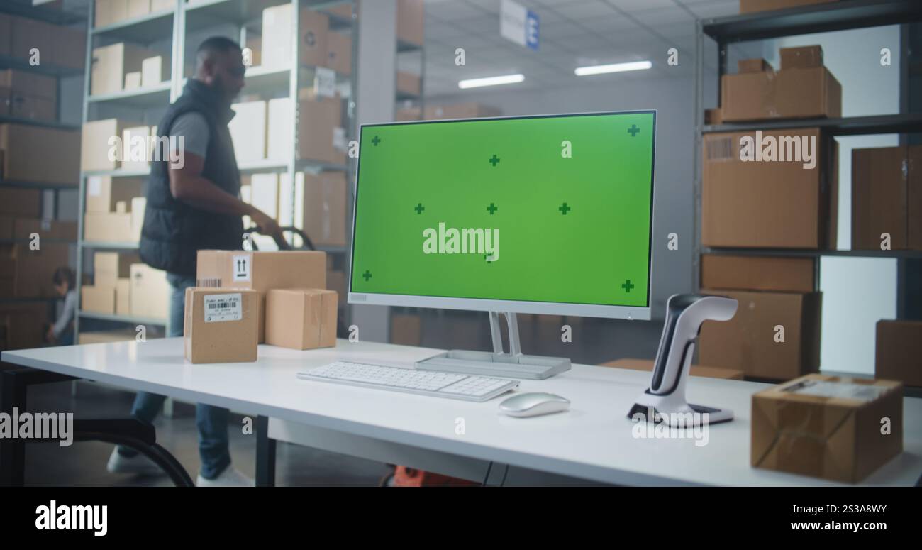 Logistics Facility: Computer Screen Shows Green Screen Chroma Key Template. Warehouse Associate ...
