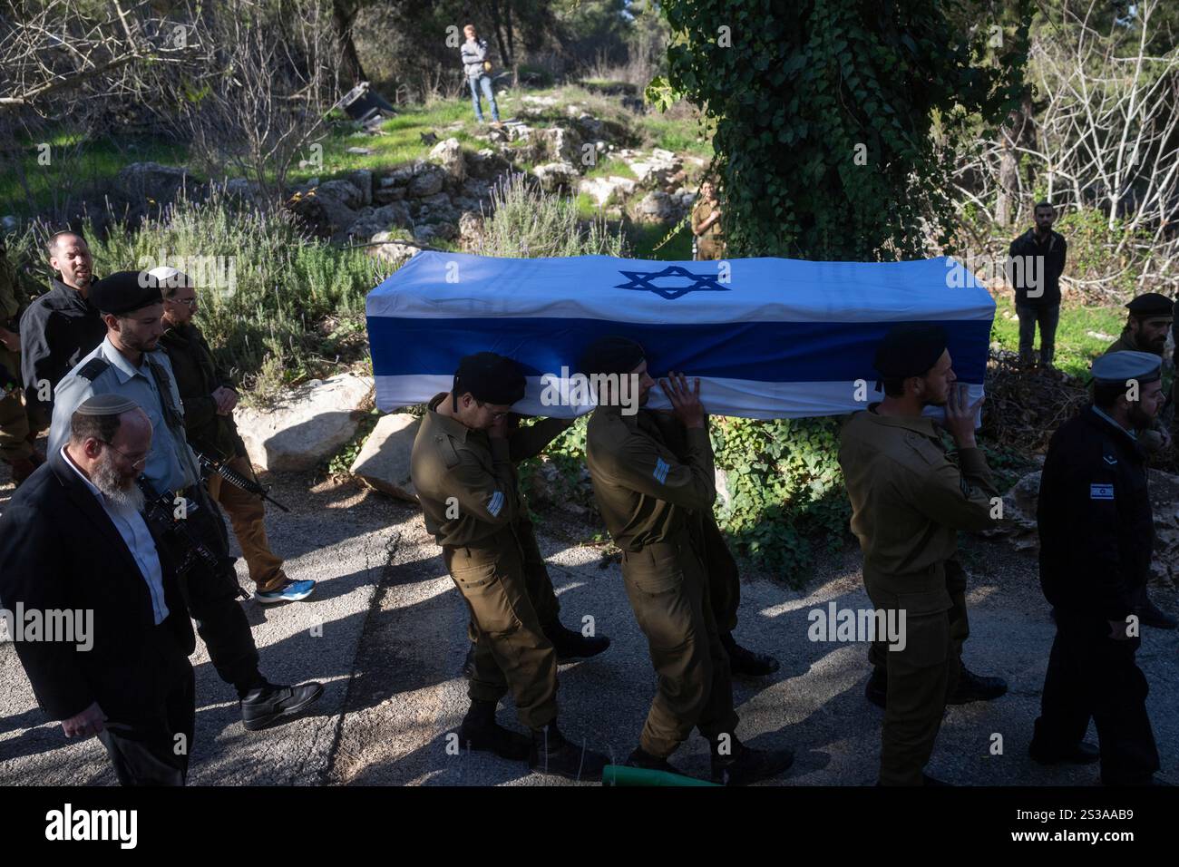 Israeli soldiers and relatives carry the flag-draped casket of 1st Sgt ...