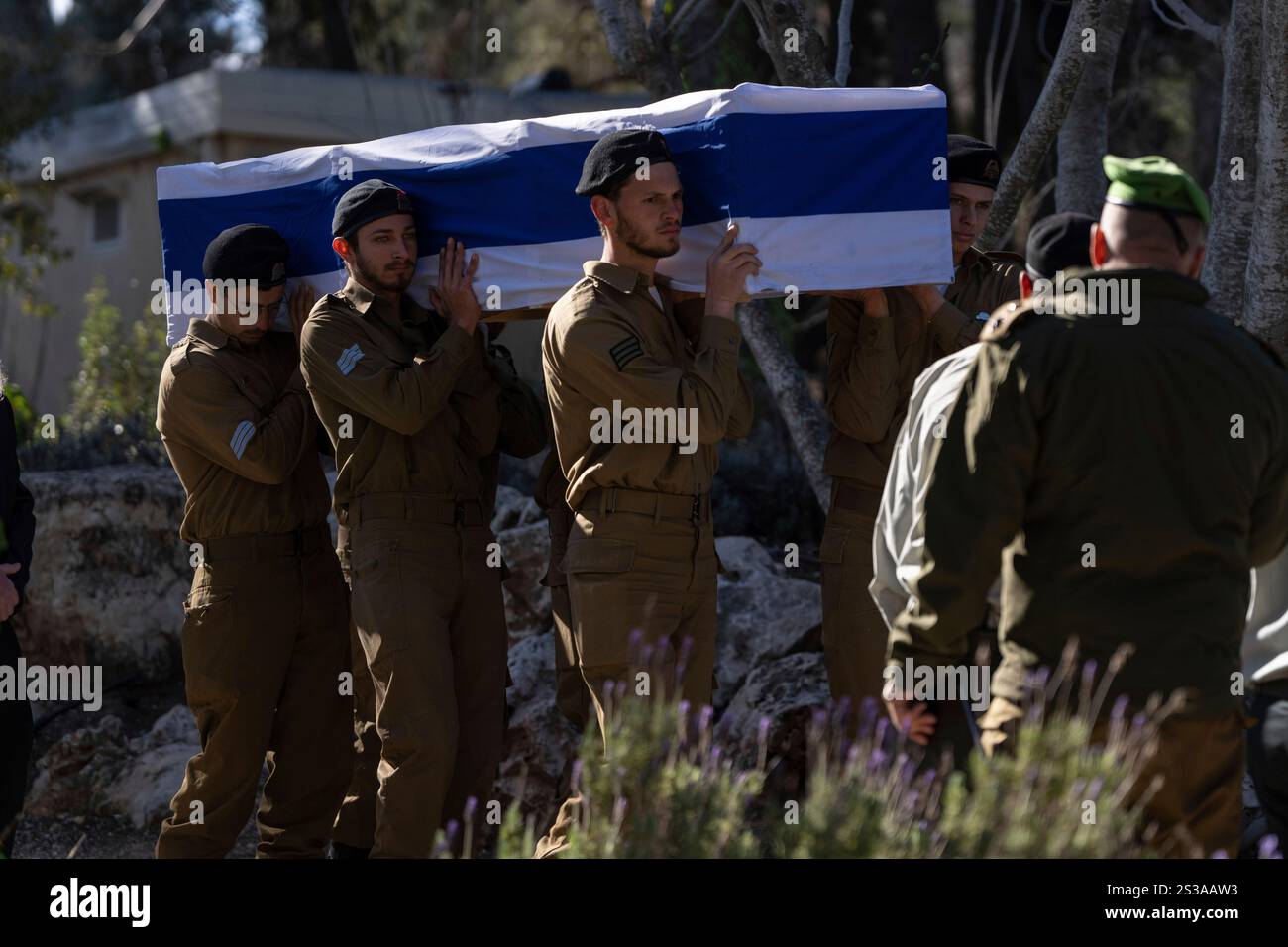 Israeli soldiers and relatives carry the flag-draped casket of 1st Sgt ...