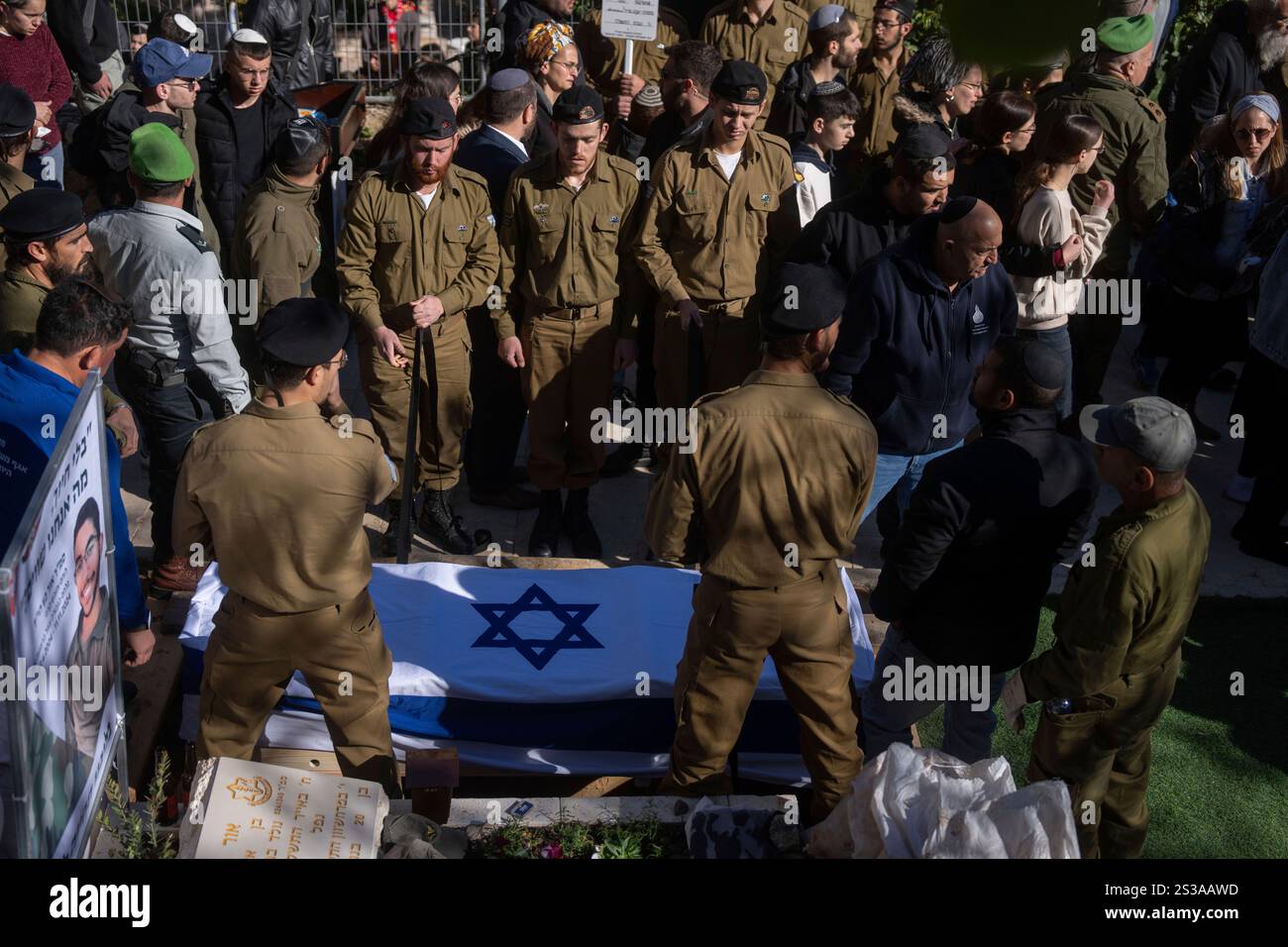 Israeli soldiers and relatives carry the flag-draped casket of 1st Sgt ...