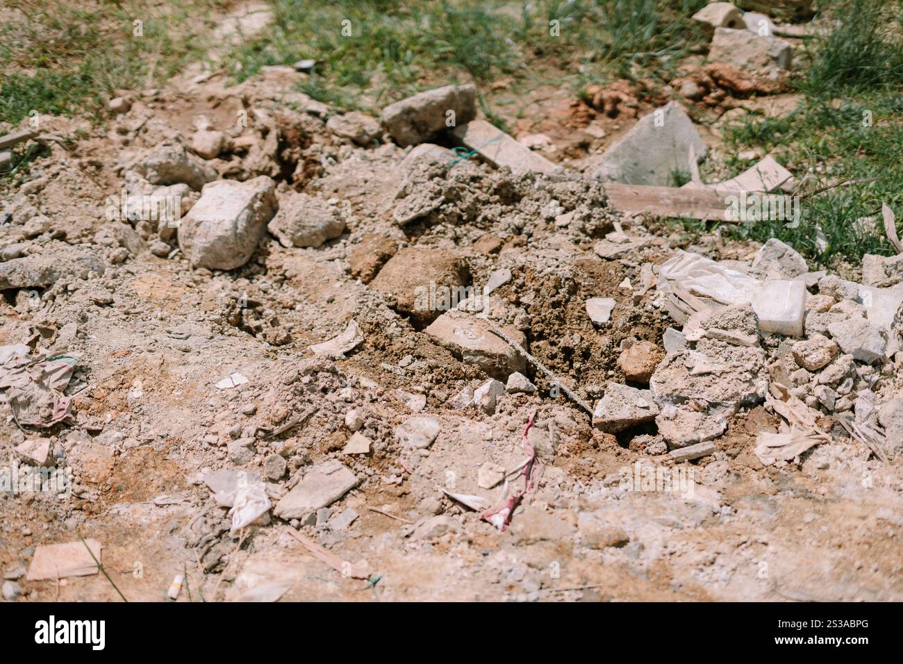 Debris and rubble from a demolished building, scattered across the ...