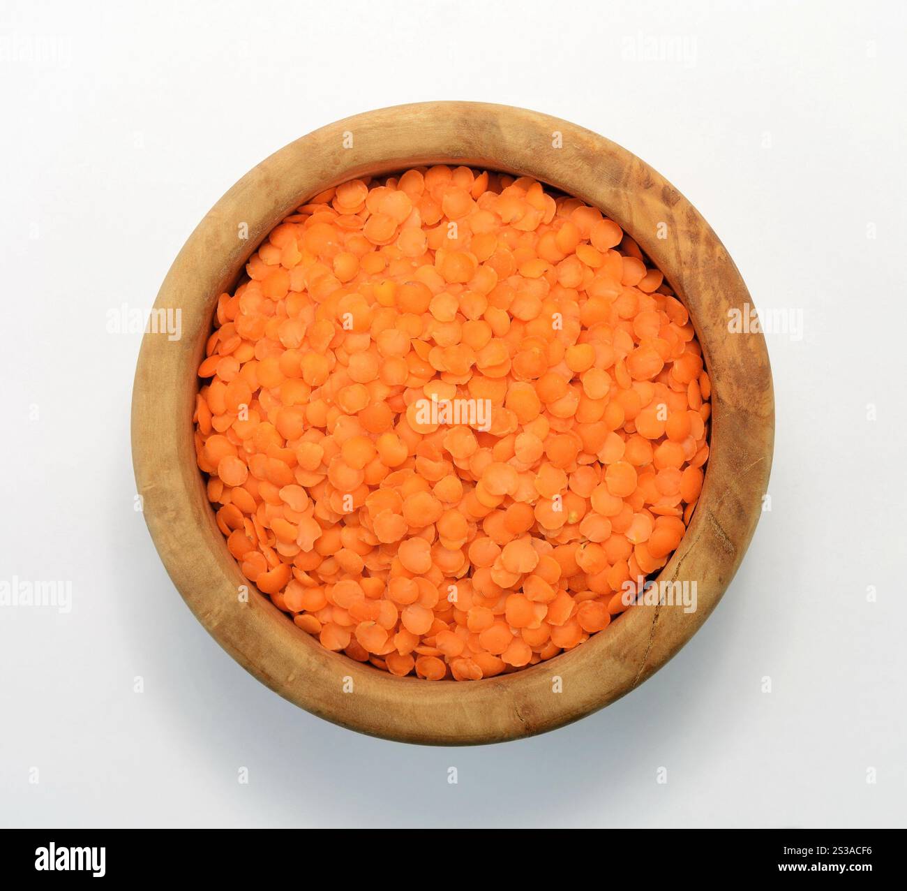 Red lentils in a wooden bowl isolated on white background. Red lentils ...