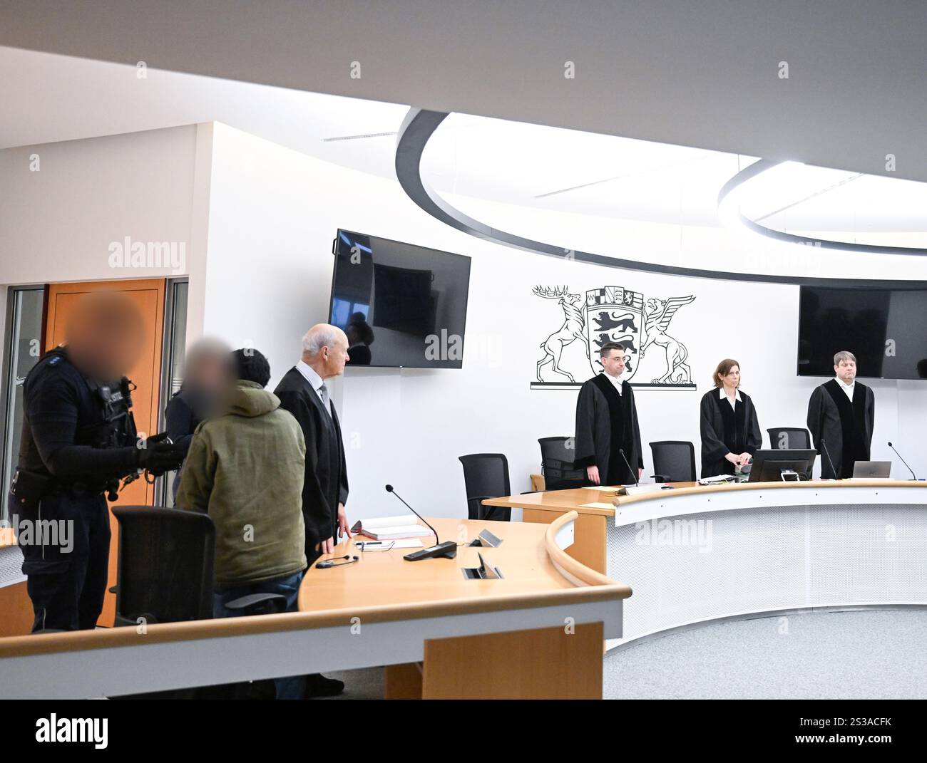 09 January 2025, Baden-Württemberg, Stuttgart: The defendant (front) is ...
