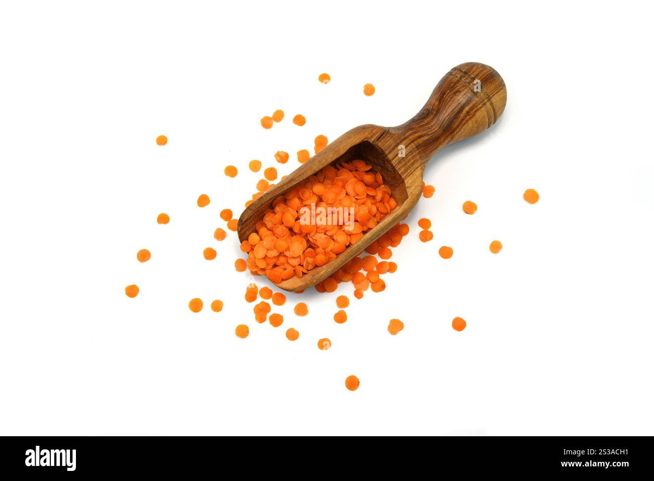 Red lentils in a wooden scoop isolated on white background. Red lentils pile isolated. Dry ...