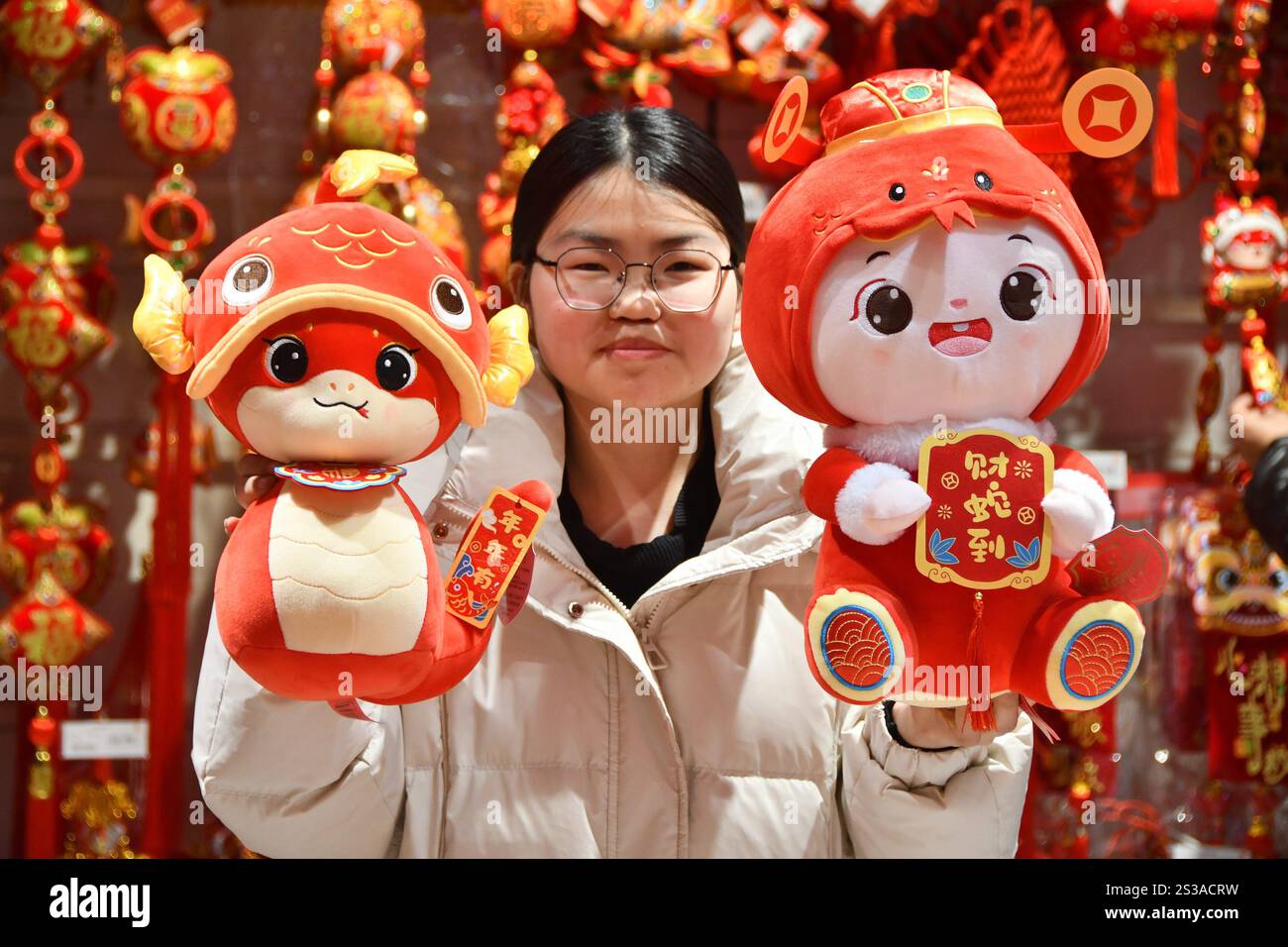 HANDAN, CHINA - JANUARY 9, 2025 - A resident displays a stuffed animal ...