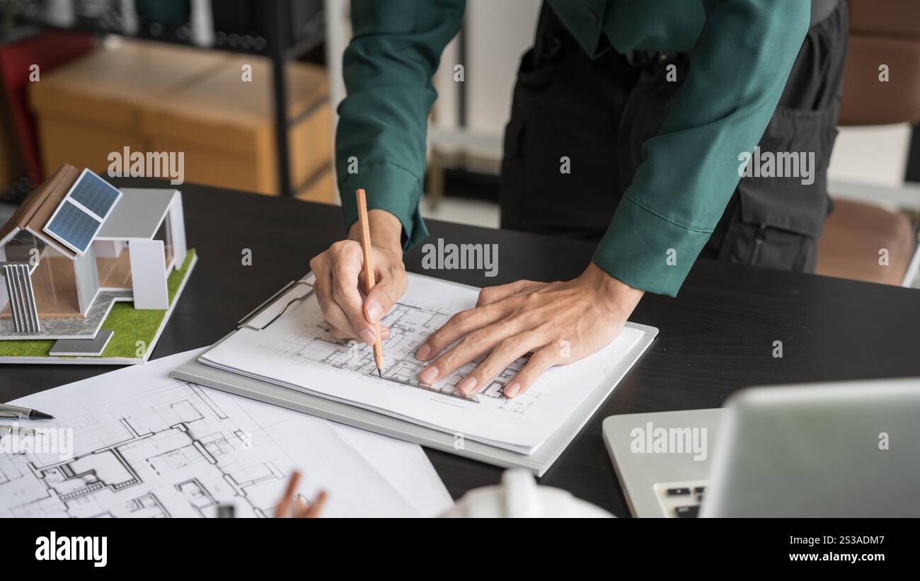 Green Eco Architecture Man drawing on architectural Creative project ...