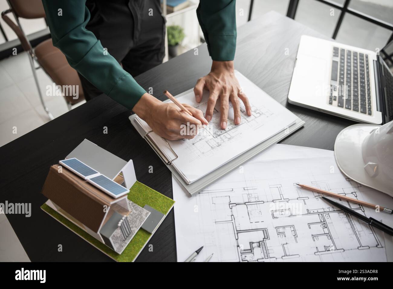 Green Eco Architecture Man drawing on architectural Creative project ...