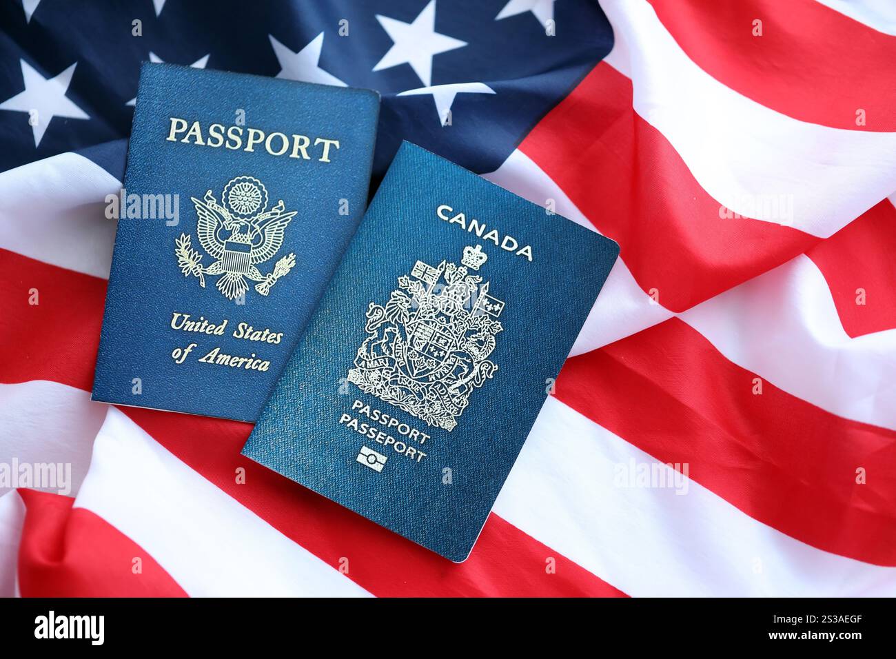 Passport of Canada with US Passport on United States of America folded ...