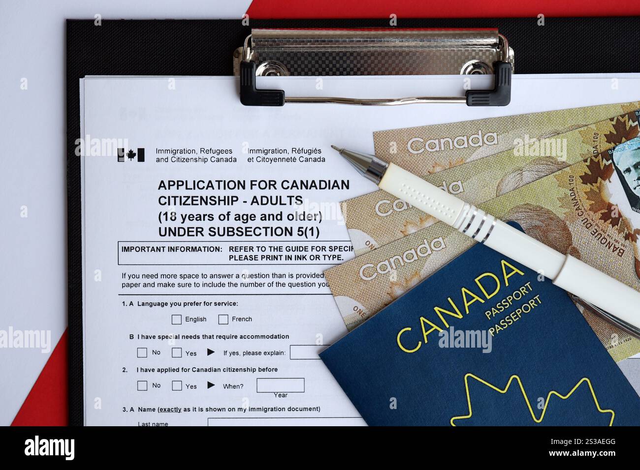 Application for Canadian citizenship for adults on table with pen ...