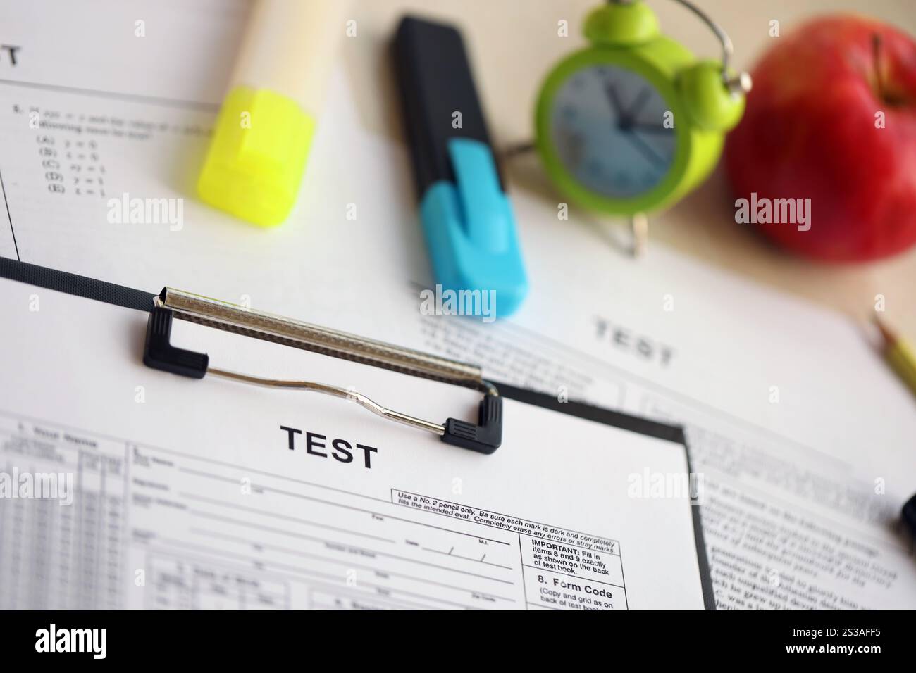 Blank educational test for students lies on table in classroom with ...