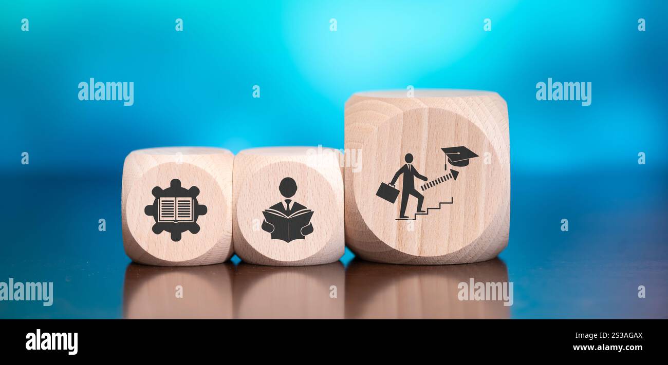Wooden blocks with symbol of continuing education concept on blue ...