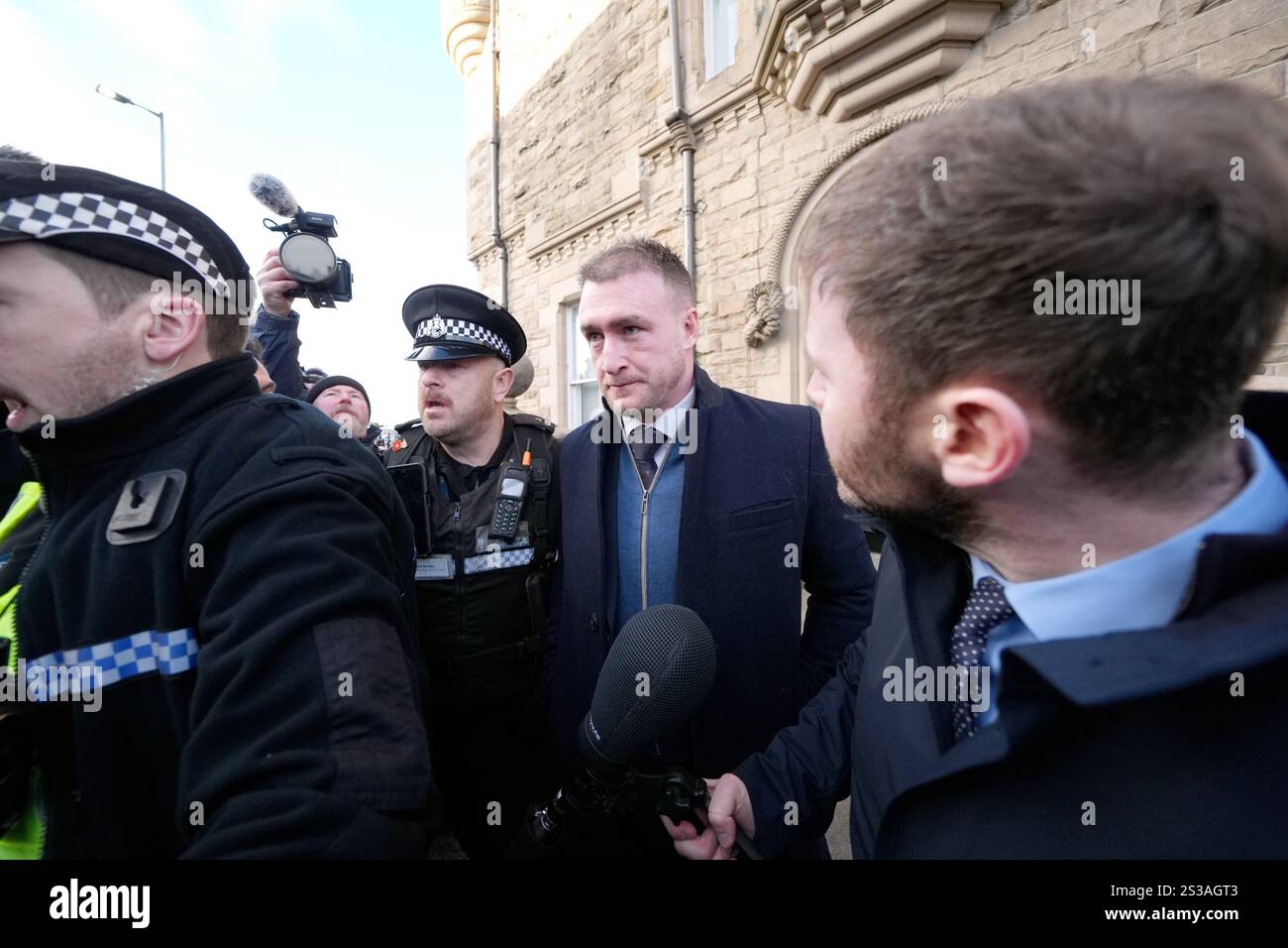 Former Scotland rugby captain Stuart Hogg (centre) leaves Selkirk ...