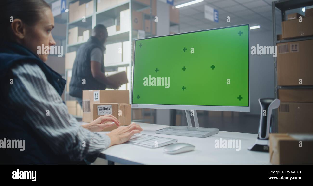 Female Postal Warehouse Associate Works on Computer in Delivery Service ...