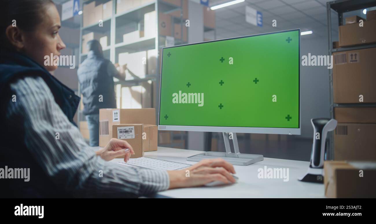 Female Postal Warehouse Associate Works on Computer in Delivery Service ...