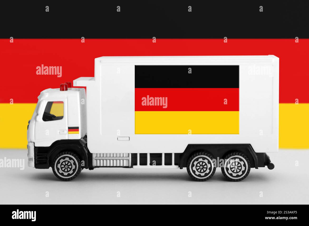 Germany flag depicted on side wall of white delivery van close up ...