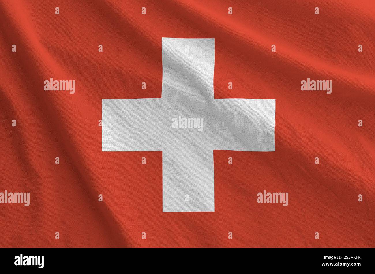 Switzerland flag depicted on folded wavy fabric of old cloth close up ...