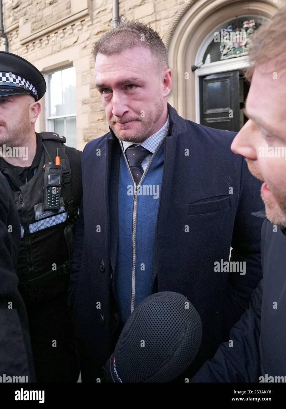 Former Scotland rugby captain Stuart Hogg (centre) leaves Selkirk ...