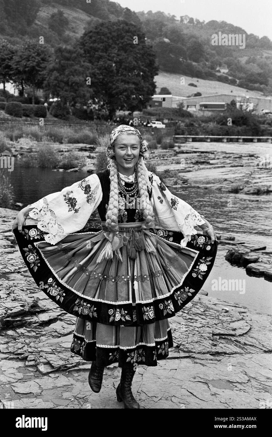 A member of an Eastern European dance troupe walking by the River Dee ...
