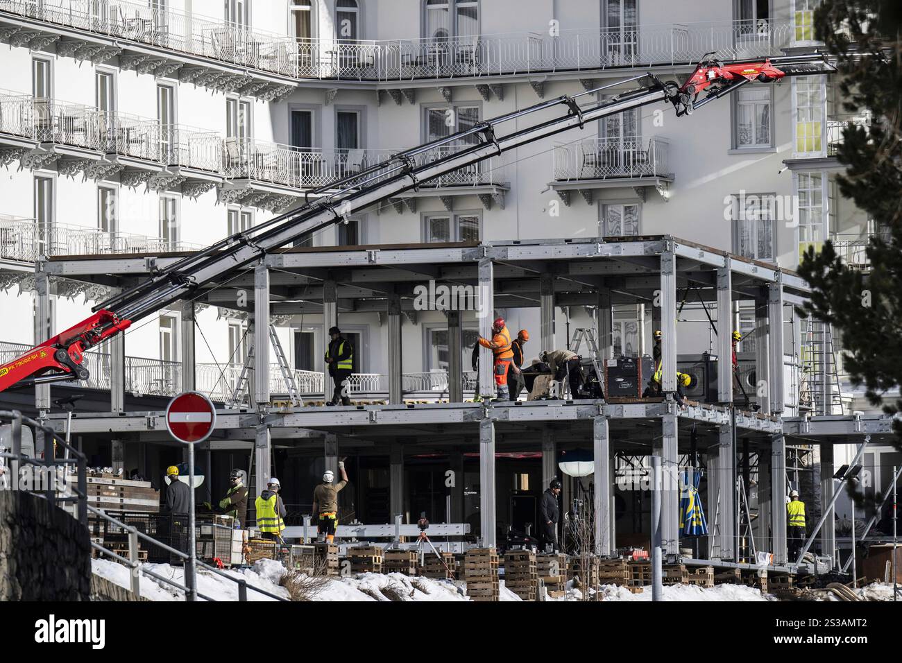 Workers set up a temporary building outside Hotel Steigenberger ...