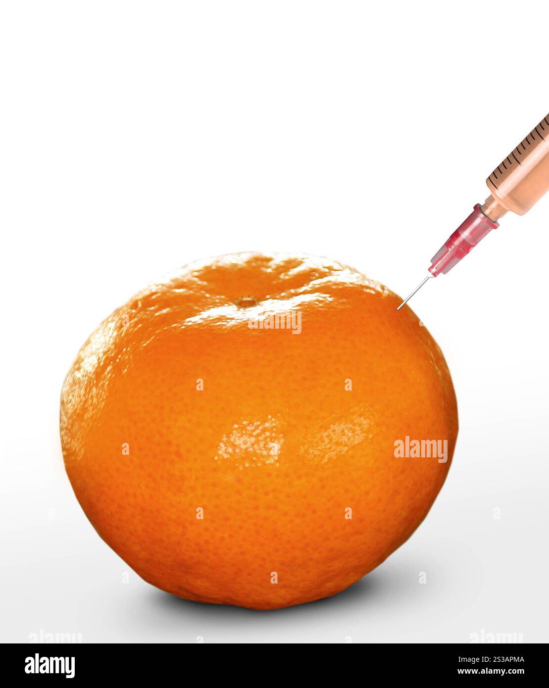 syringe sticked into orange,GMO isolated on a white background. syringe ...