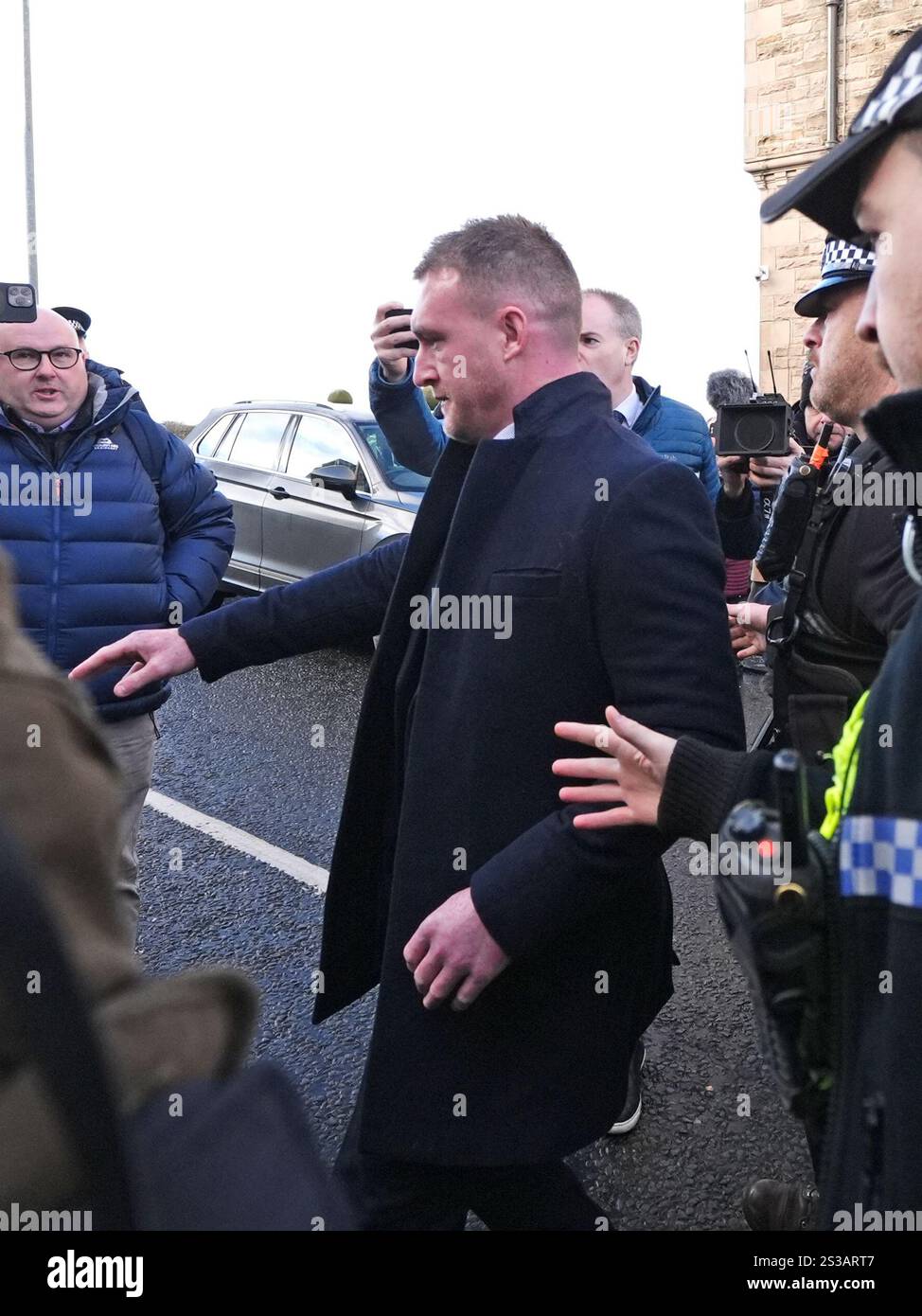 Former Scotland rugby captain Stuart Hogg (centre) leaves Selkirk ...