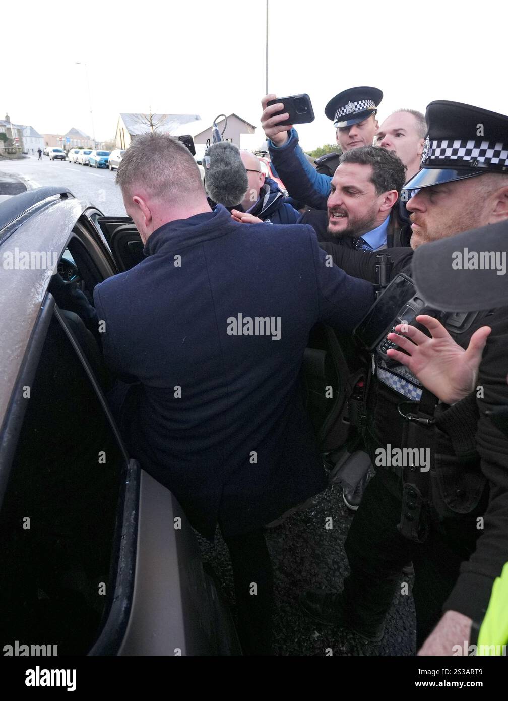 Former Scotland rugby captain Stuart Hogg (centre) leaves Selkirk ...