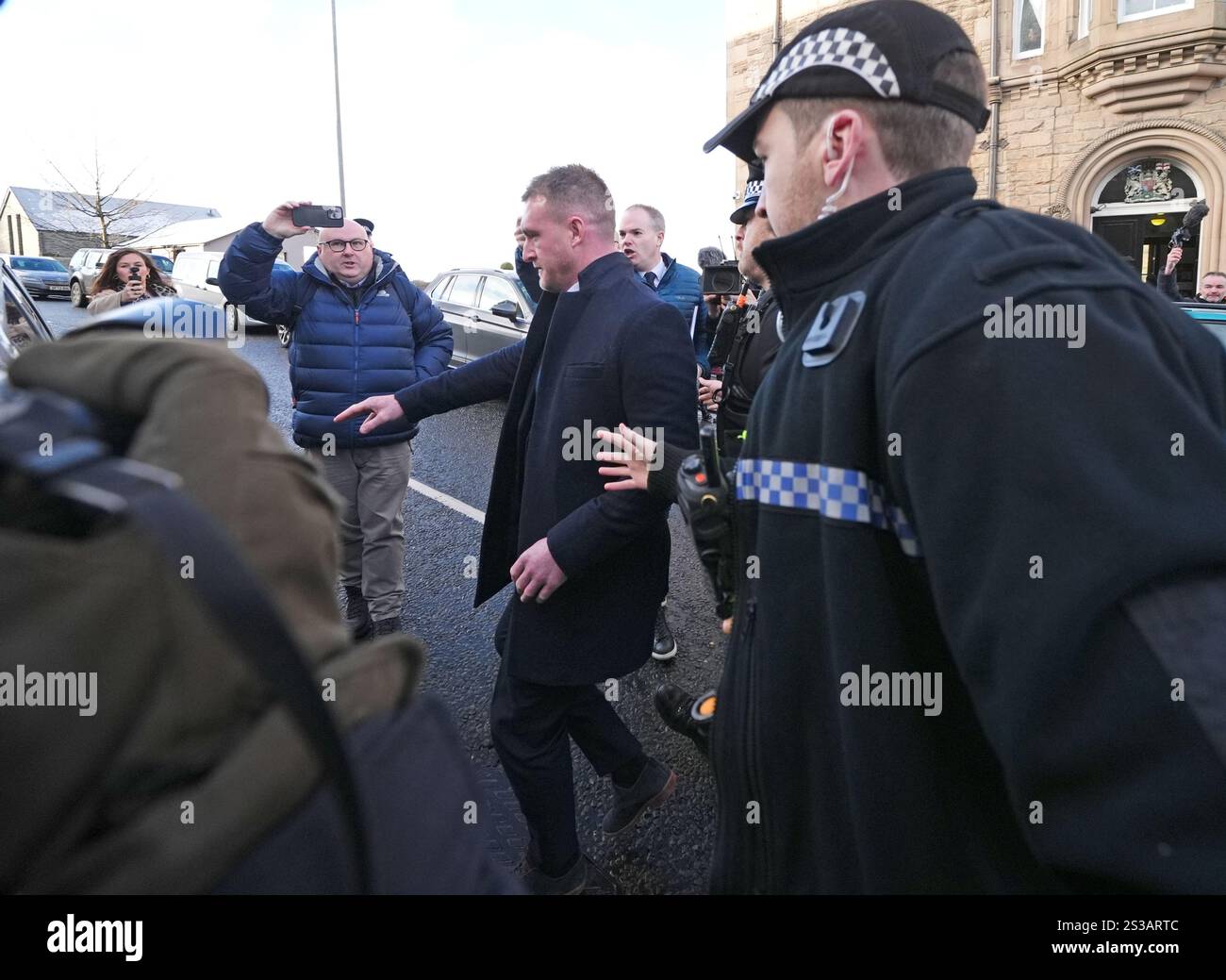 Former Scotland rugby captain Stuart Hogg (centre) leaves Selkirk ...