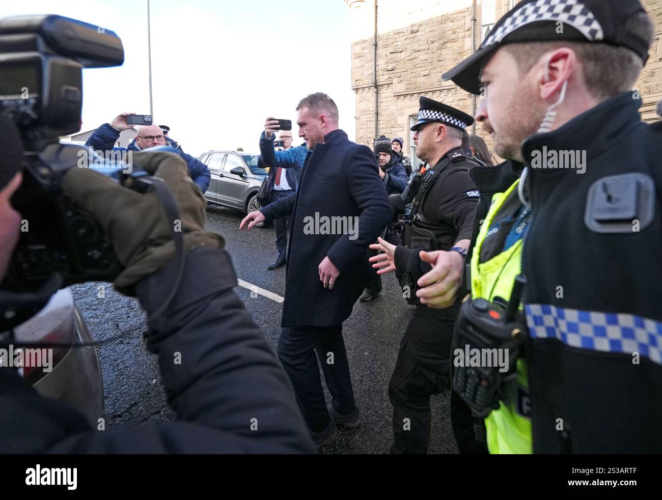 Former Scotland rugby captain Stuart Hogg (centre) leaves Selkirk ...
