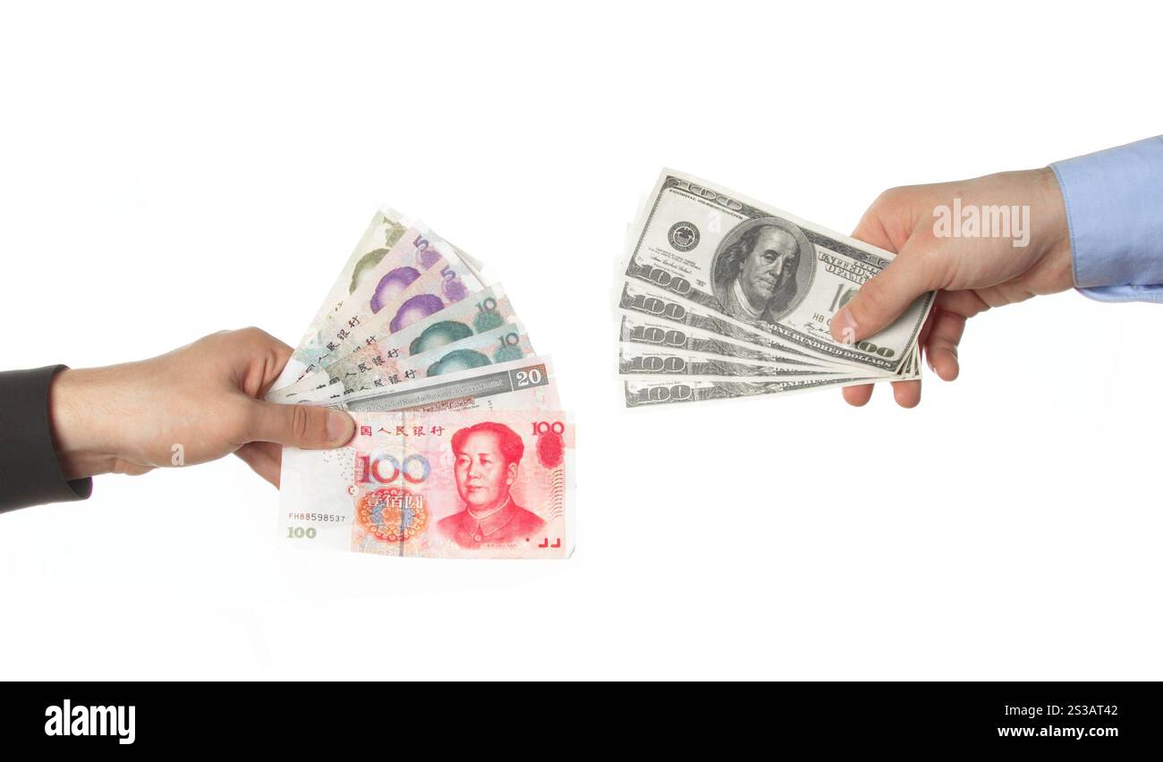 Hands holding yuan and dollar bills isolated on white background. Hands ...