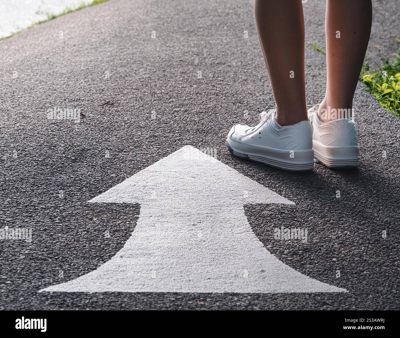 A person is positioned at the beginning of a smooth, curving pathway ...