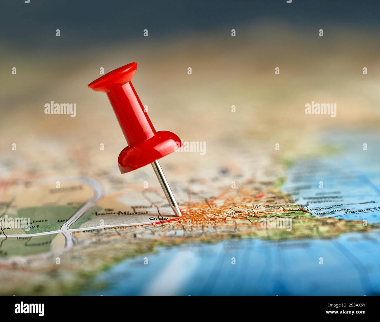 Close up image of a marker pointing to a specific location on a map ...