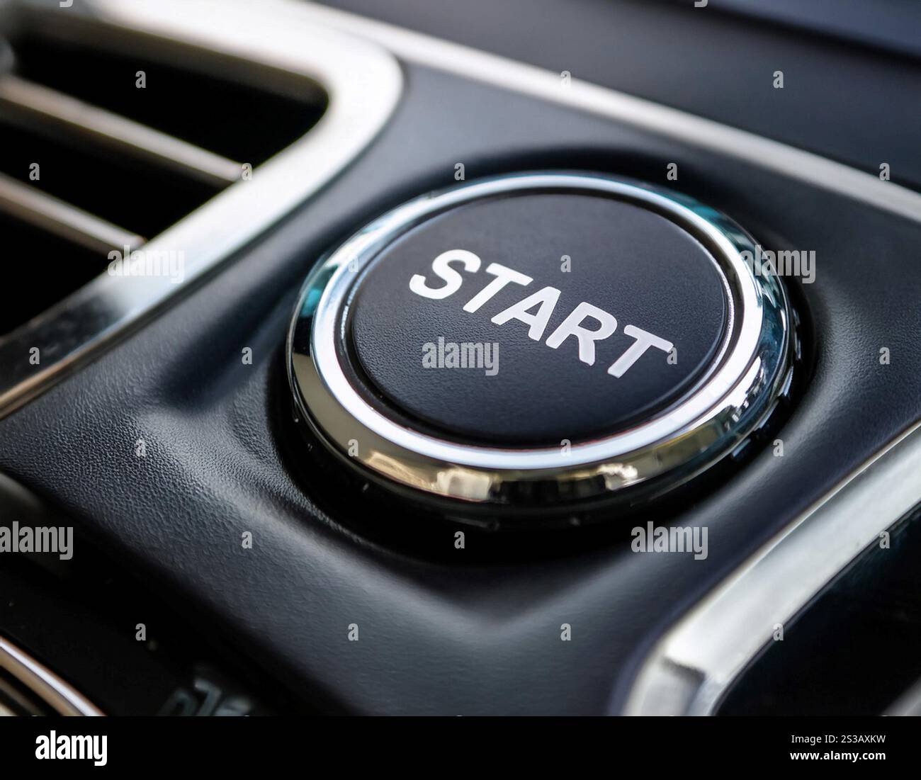 Close up image of a start button on a device, representing initiation ...