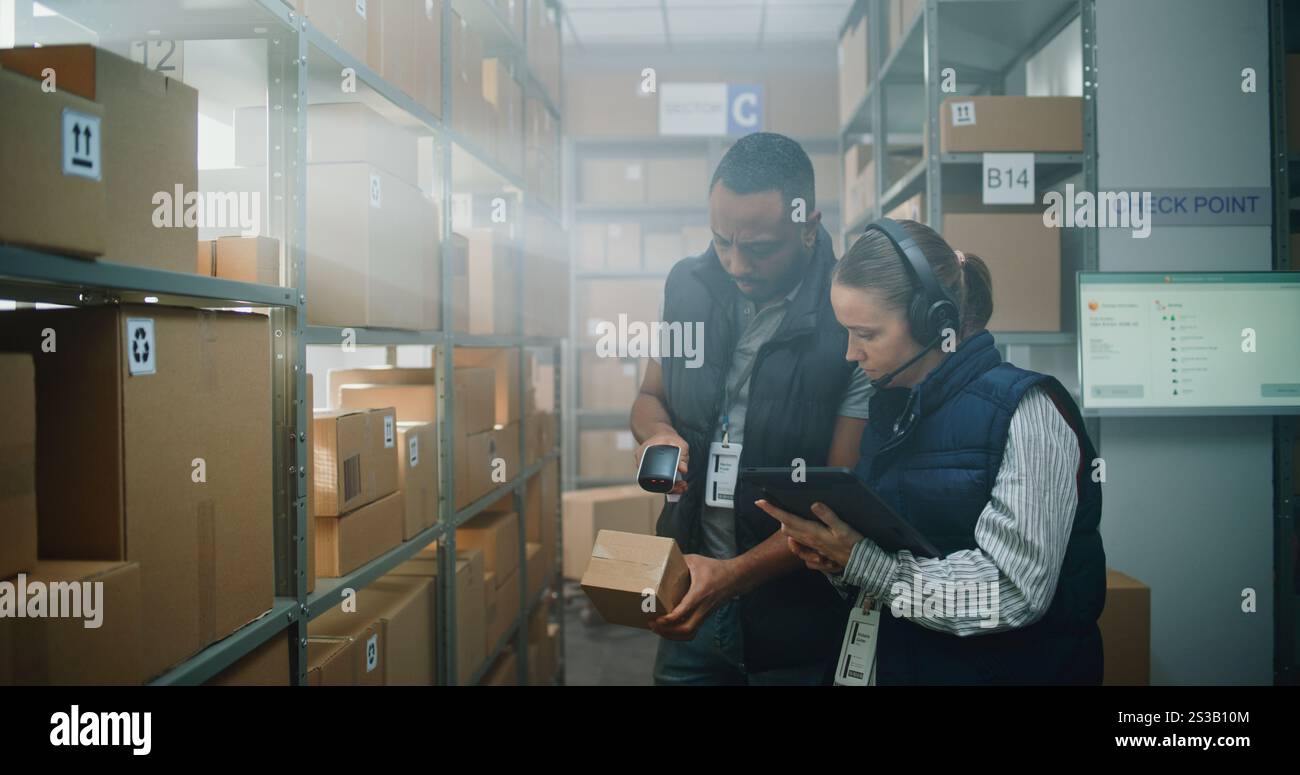 African American Sorting Center Worker Scans Cardboard Boxes with Online Orders with Scanner ...