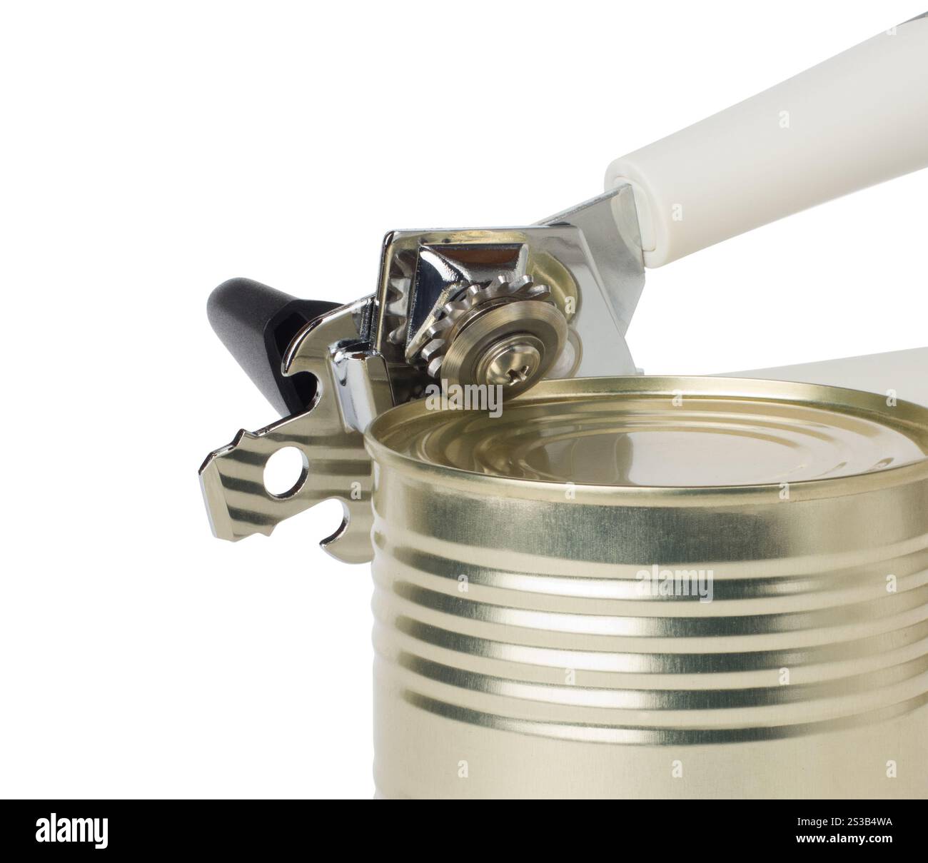 The can opener opens can. close up of the can opener Stock Photo - Alamy