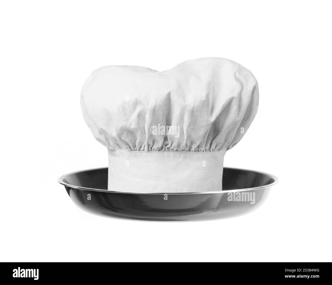 A professional chefs hat on pan - concept. professional chefs hat on ...