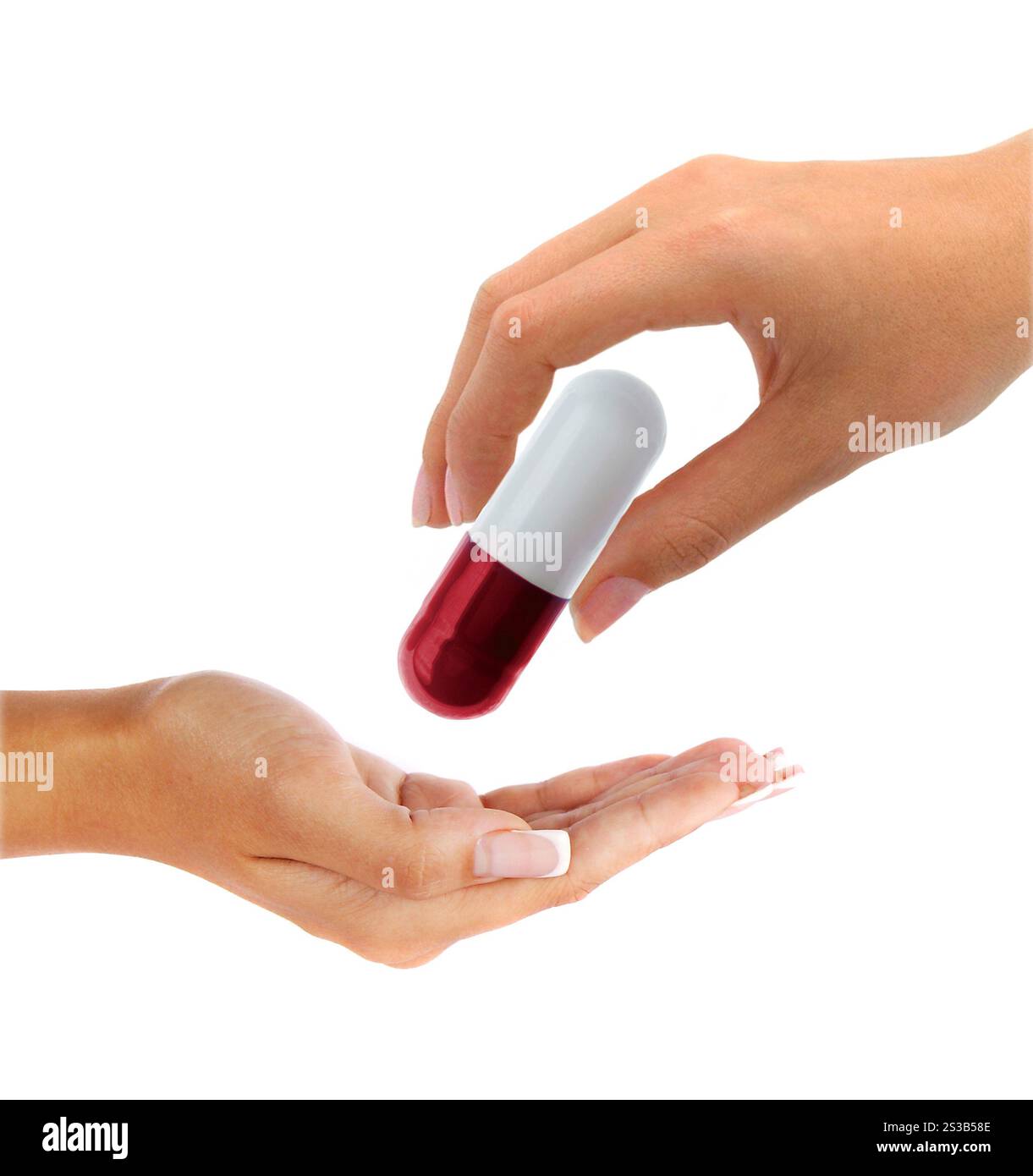 hand gives a big pill isolated on white background. hand gives a big ...