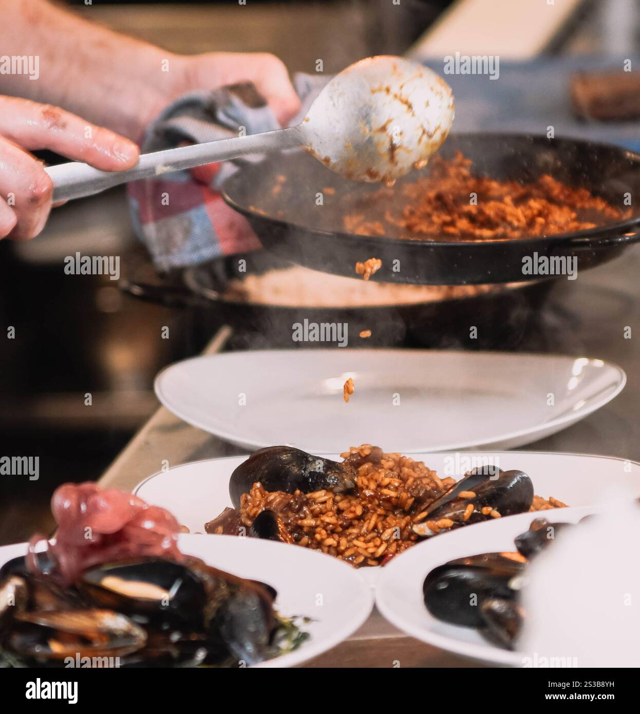 Classic Spanish rice and seafood paellas Stock Photo - Alamy